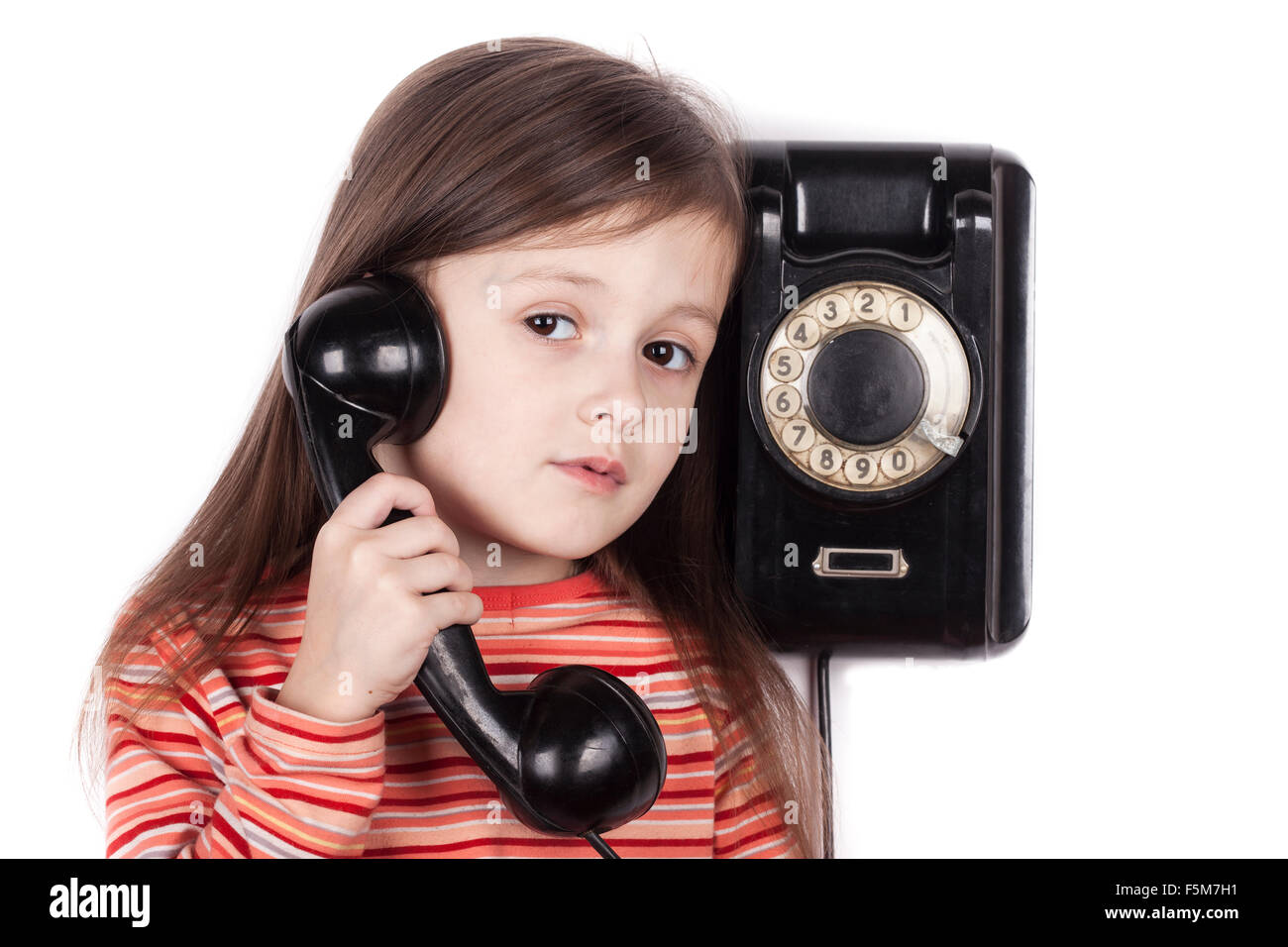 Serious sad child talking on phone isolated, white background Stock ...