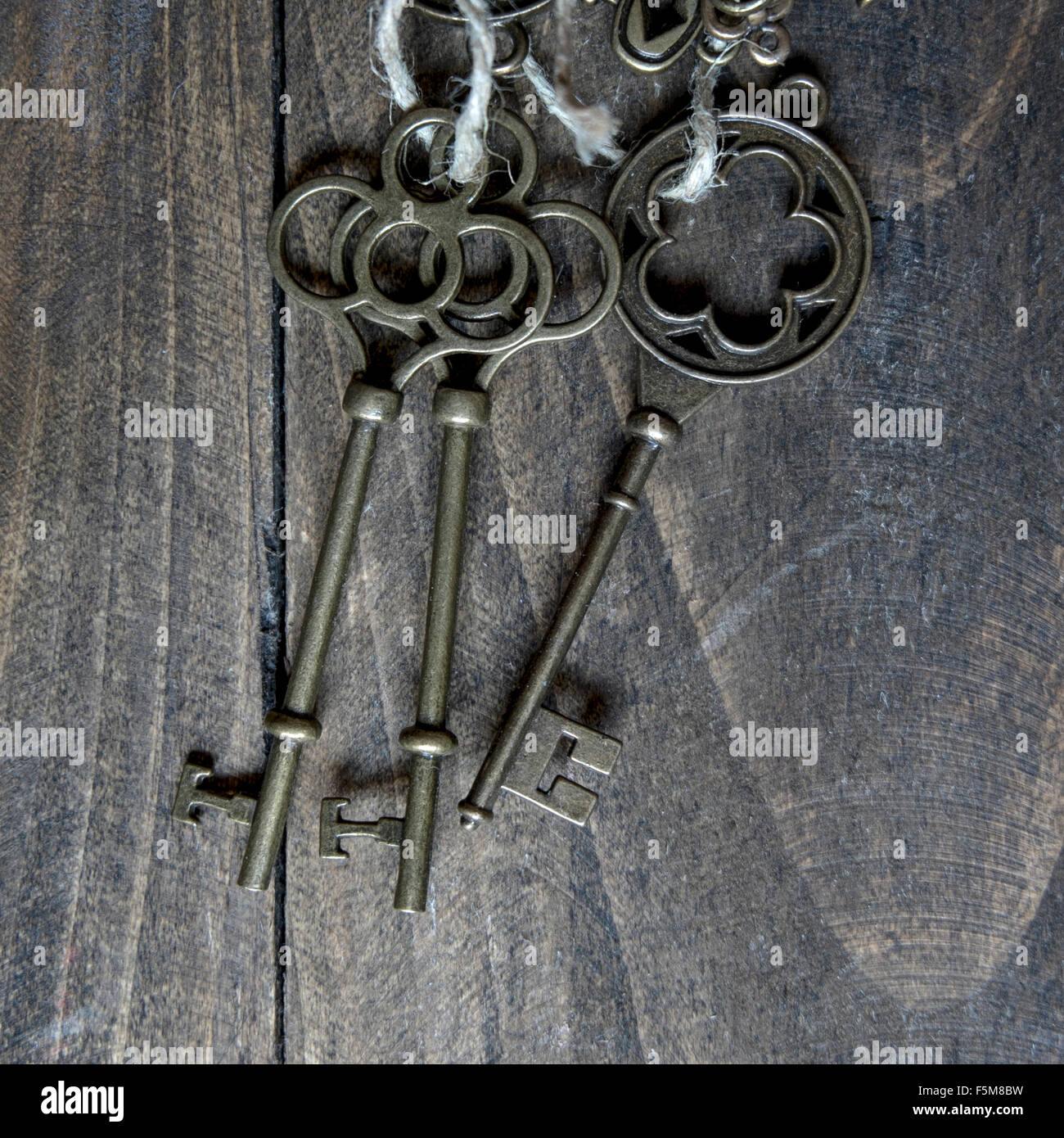 bunch of vintage keys on old wooden plank, from above Stock Photo - Alamy