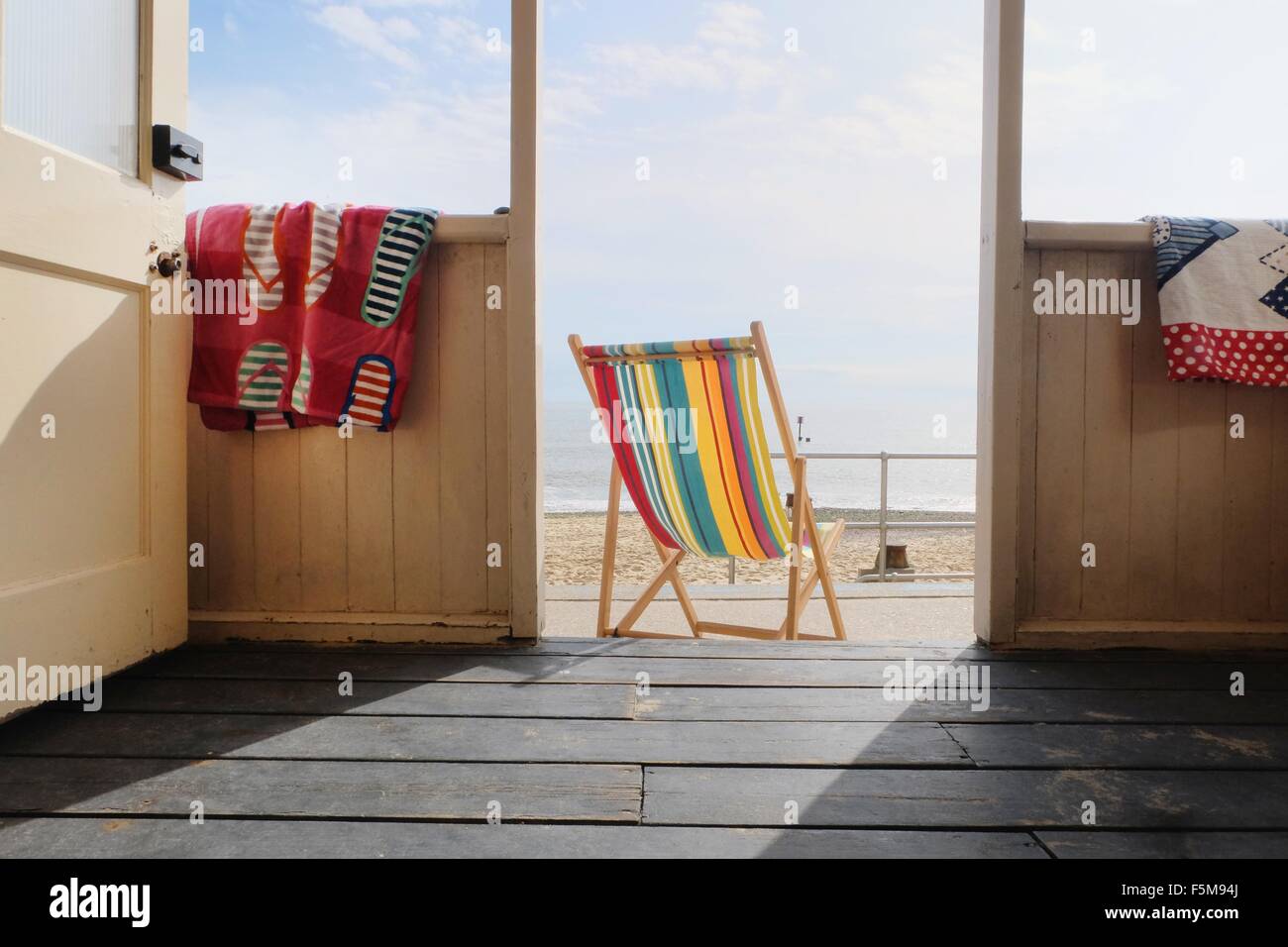 Empty deckchair outside beach hut, rear view Stock Photo - Alamy