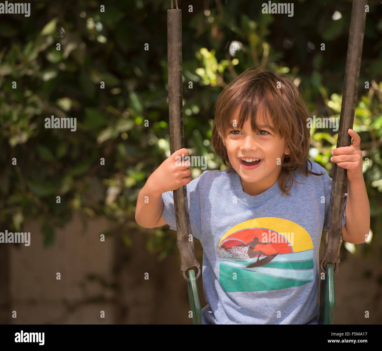 Boy garden swing hi-res stock photography and images - Alamy