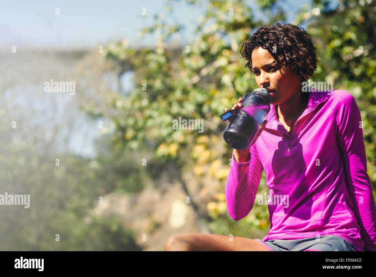 Female runner taking break in hi-res stock photography and images - Alamy