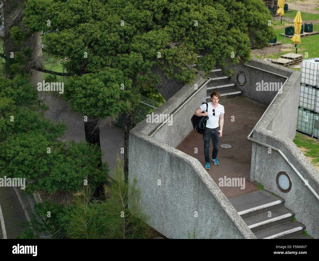 Young man walking on staircase, Melbourne, Victoria, Australia Stock ...