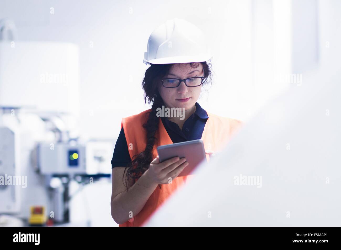Technician working in factory Stock Photo - Alamy