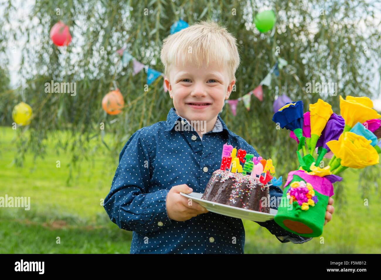 Boy carrying cake hi-res stock photography and images - Alamy