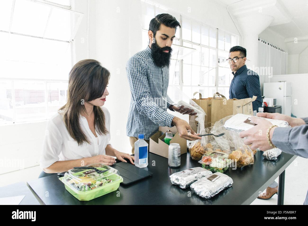 Business people having lunch together Stock Photo - Alamy