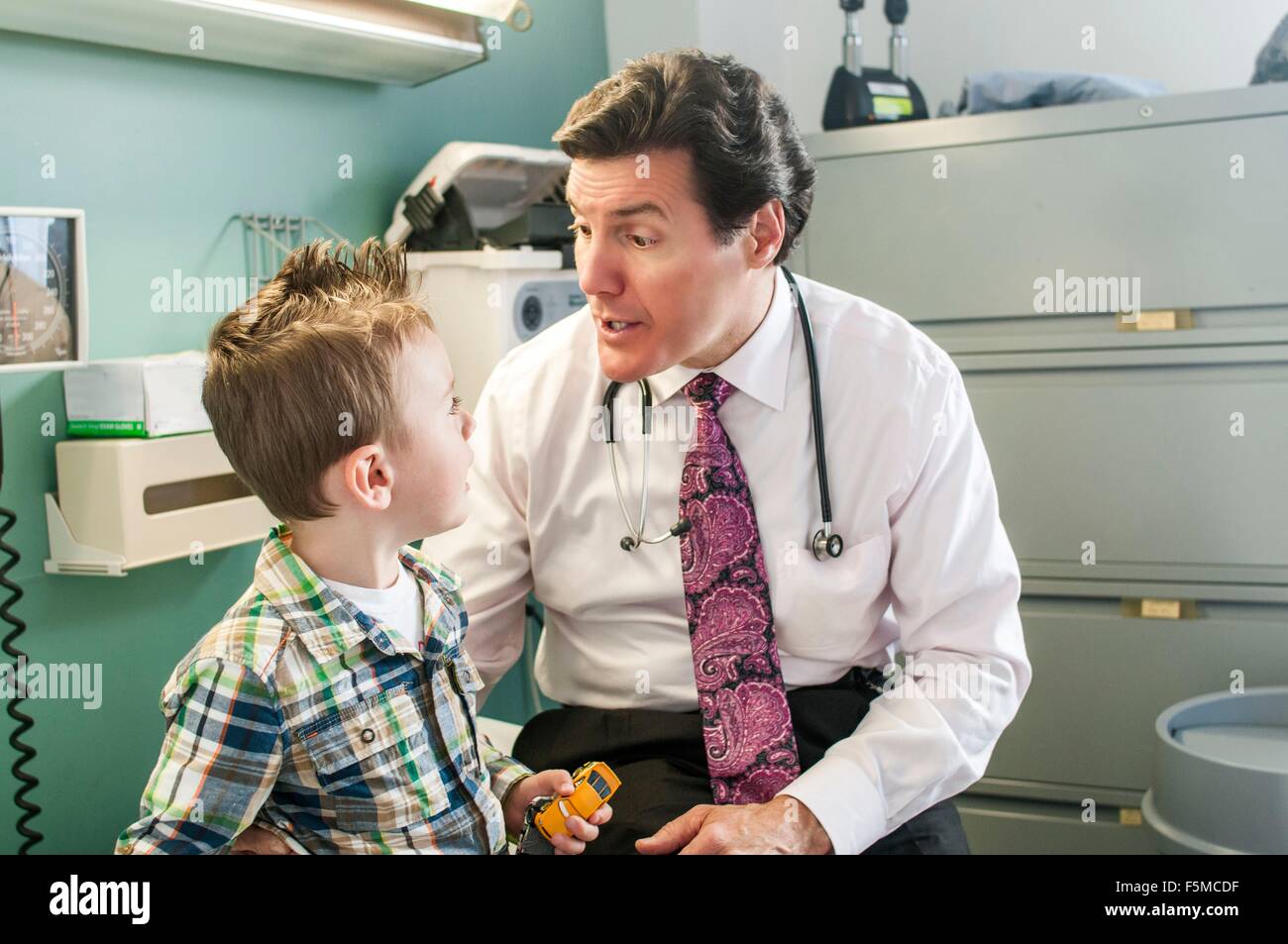 Young boy having check-up in doctor's office Stock Photo - Alamy