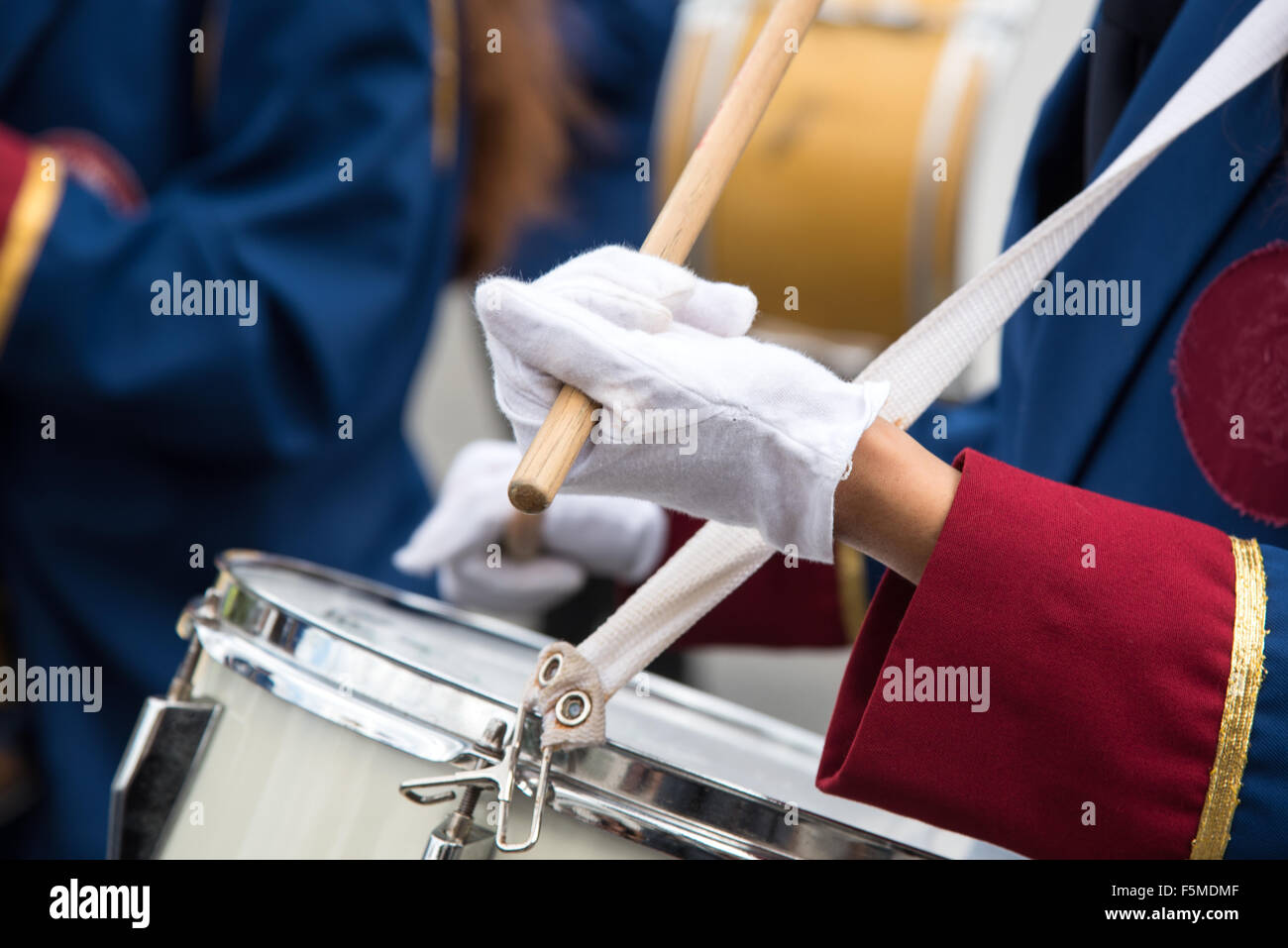 Teenage Students in Uniform playing drums during a parade for the ...