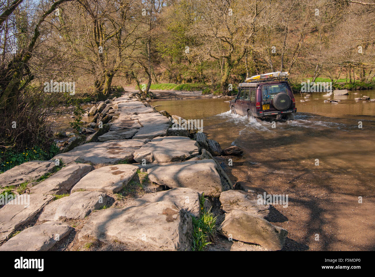 Tarr Steps Clapper Bridge and the River Barle, Devon, UK Stock Photo ...