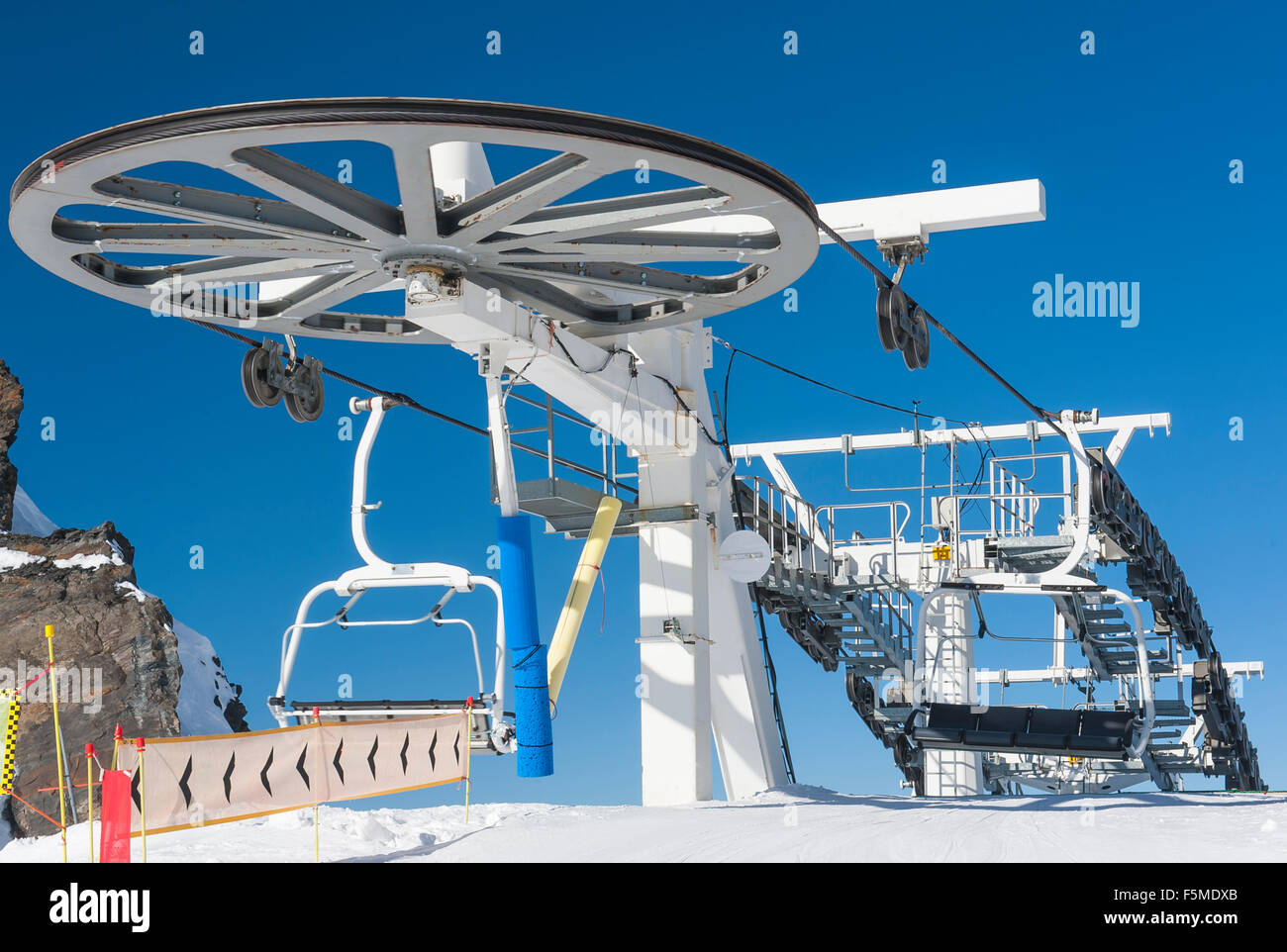 Top of an alpine chairlift on mountain in ski resort Stock Photo - Alamy