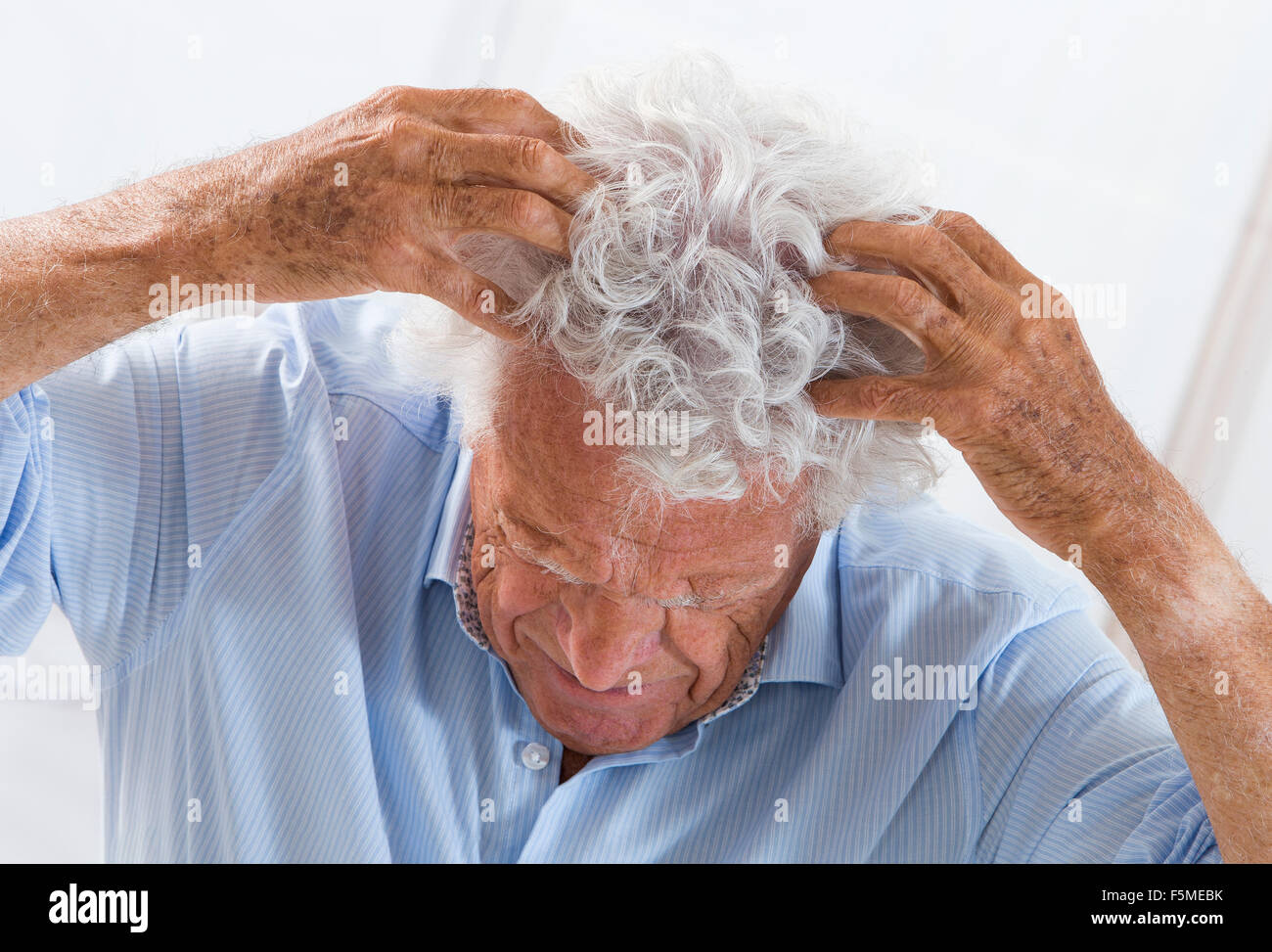 Man scratching neck hi-res stock photography and images - Alamy