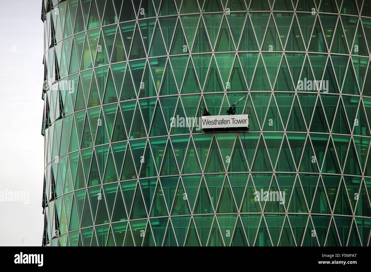 Window cleaners at work on the green-fronted Westhafen Tower in ...