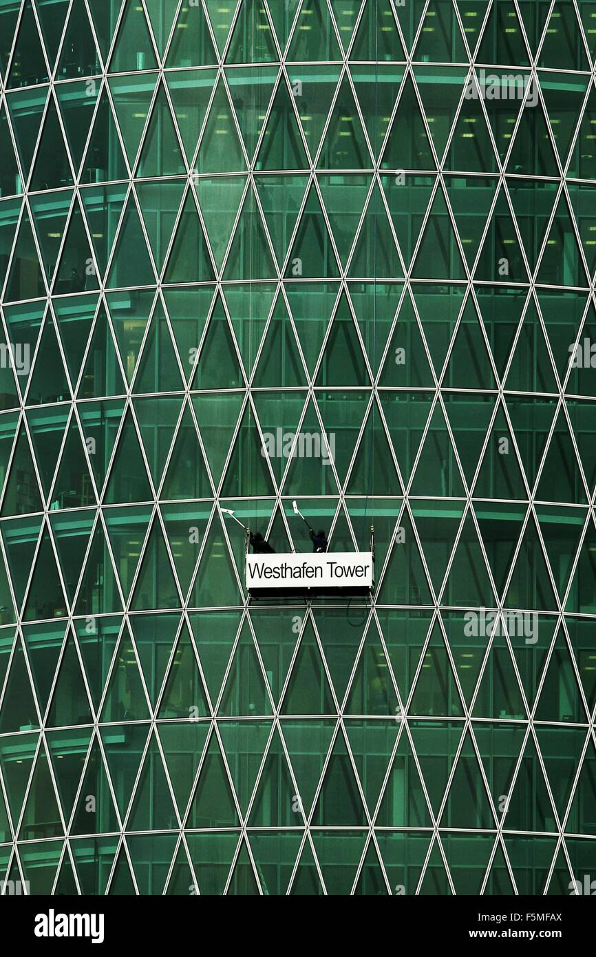 Window cleaners at work on the green-fronted Westhafen Tower in ...