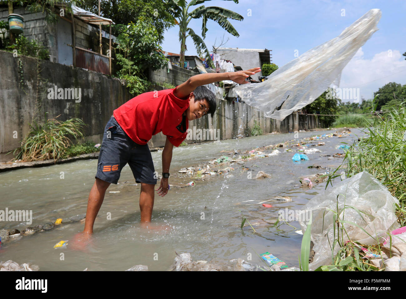 Man Throwing Garbage In The River