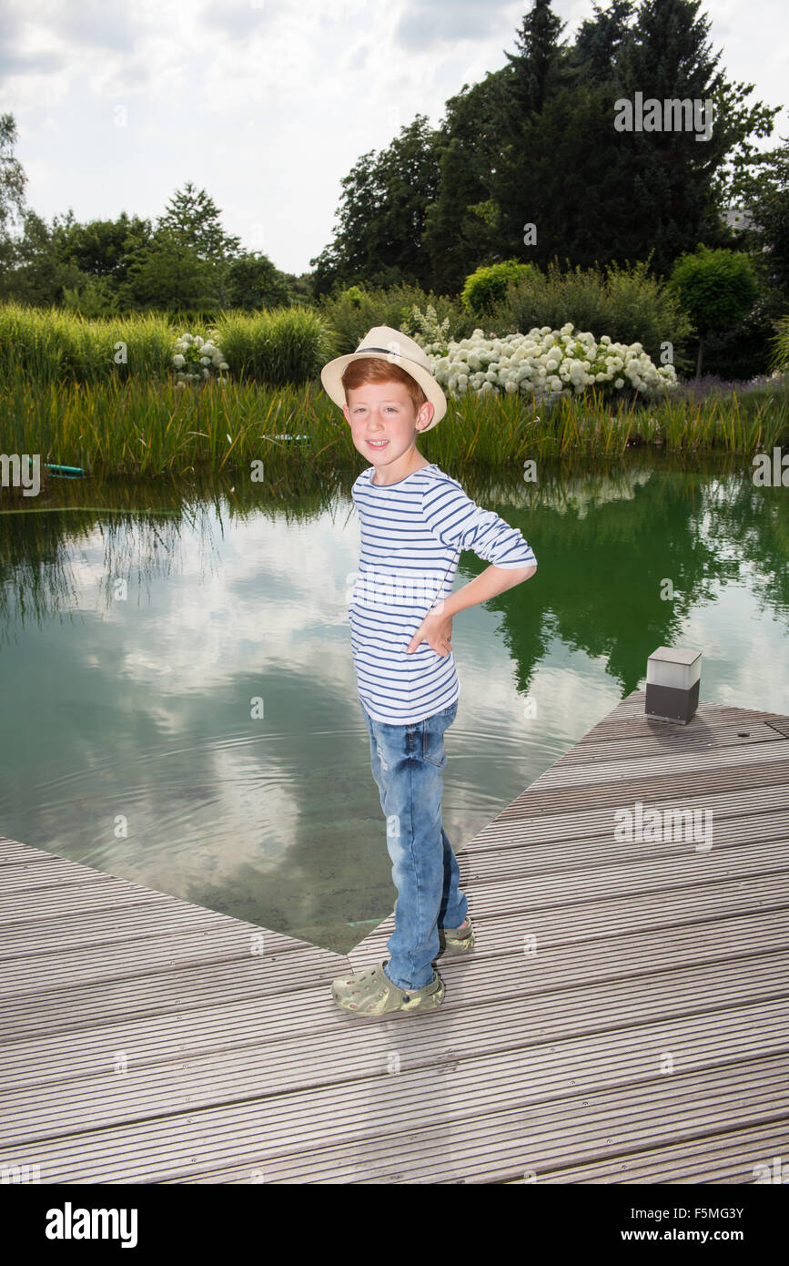 Boy with hat outside hi-res stock photography and images - Alamy