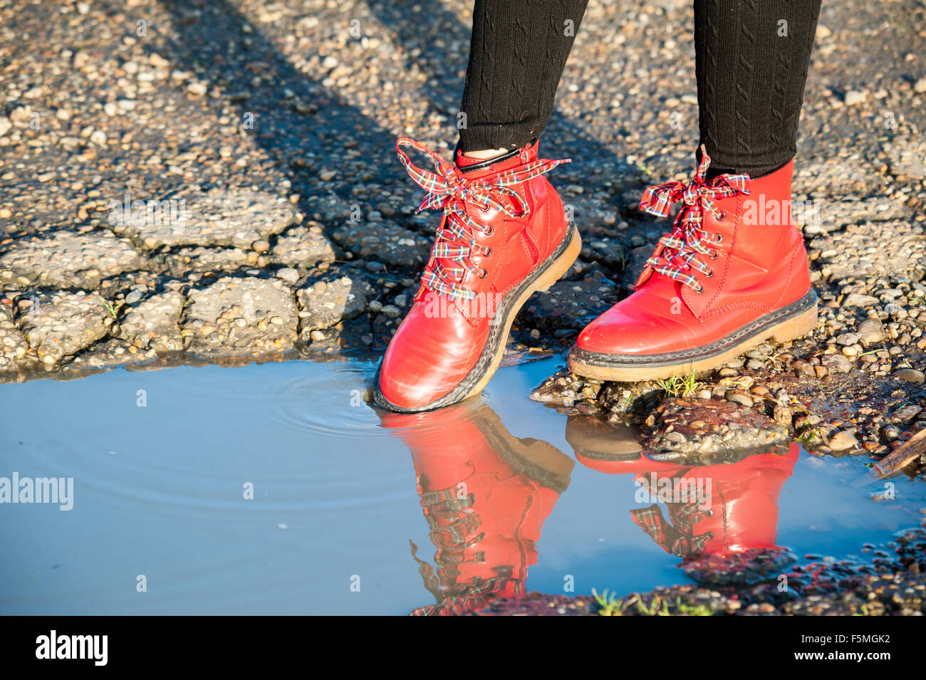 Red shoes in puddle Stock Photo - Alamy