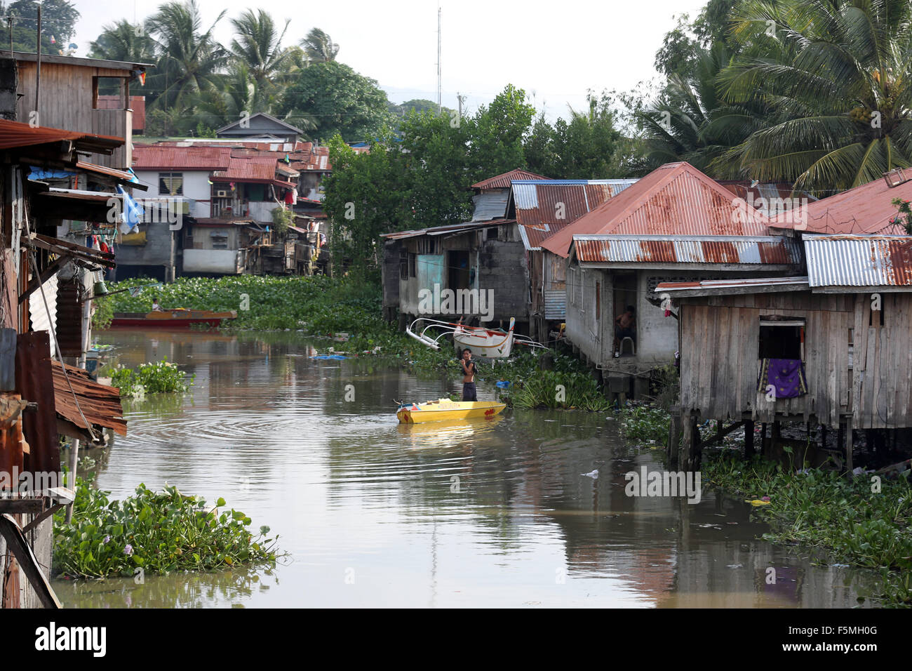 Boat on a River in a poor neighborhood of the City of Cotabato ...