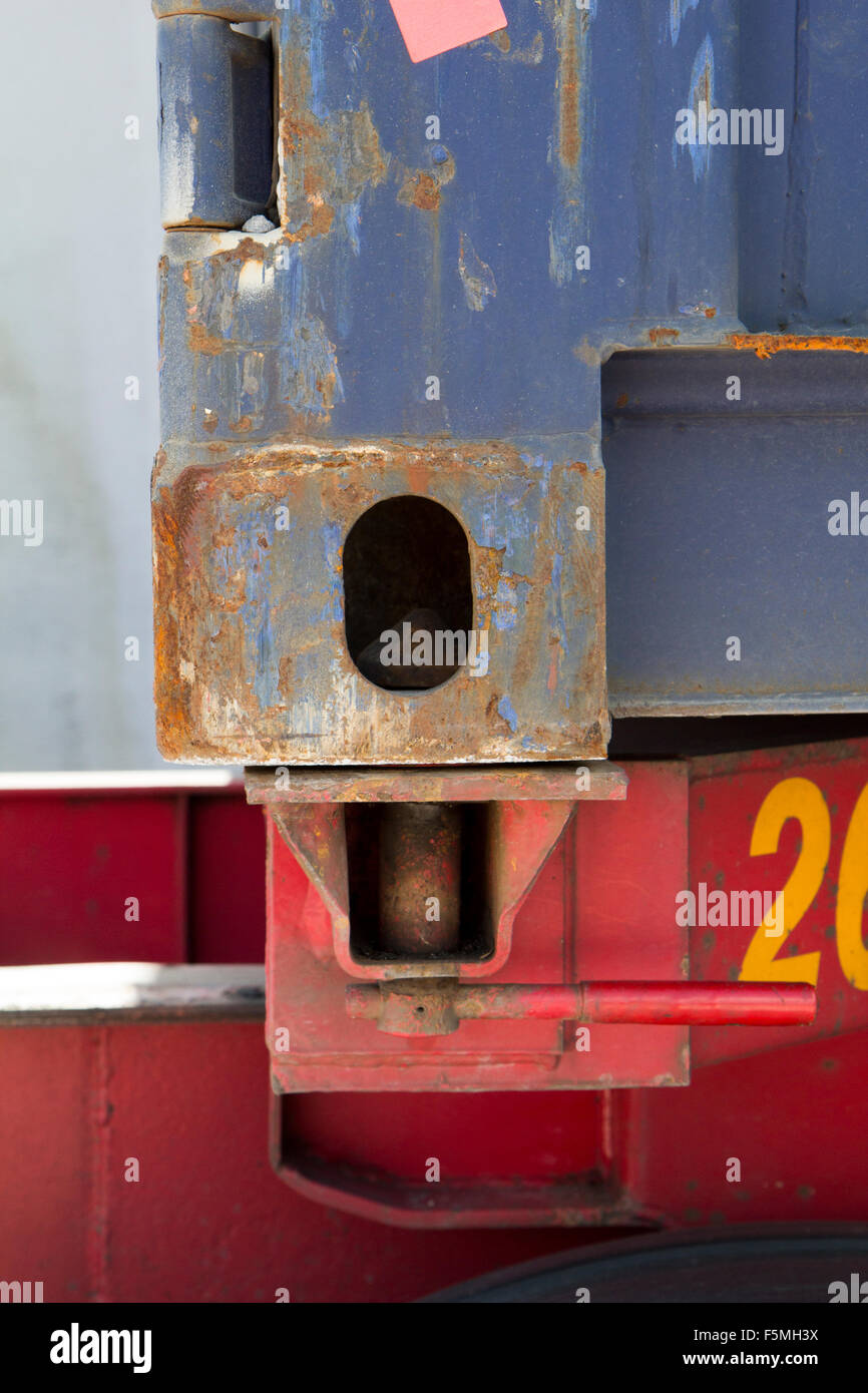 Securing pin of a shipping container to a lorry trailer Stock Photo - Alamy