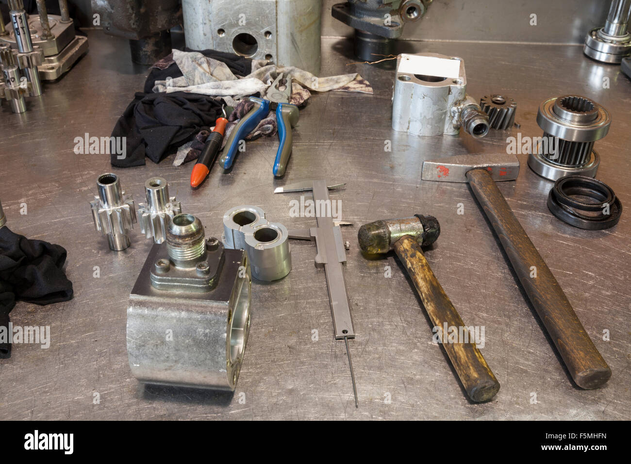 hydraulic engine parts on the work table Stock Photo - Alamy