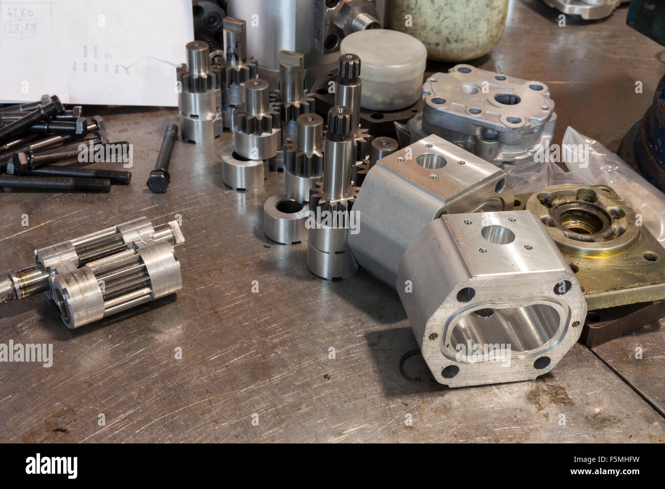 hydraulic engine parts on the work table Stock Photo - Alamy