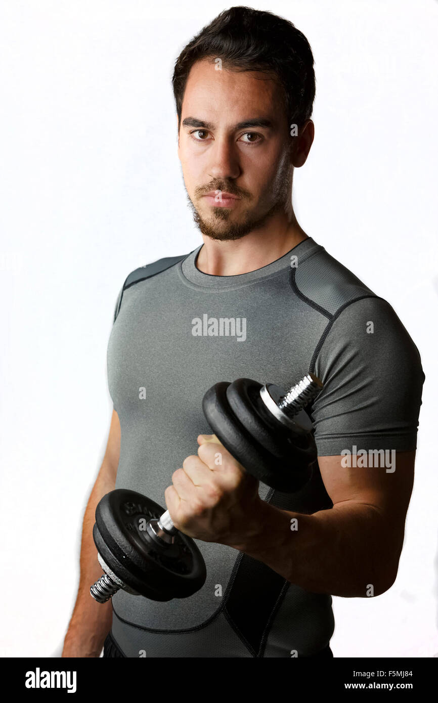 Athletic man lifting dumbell Stock Photo - Alamy