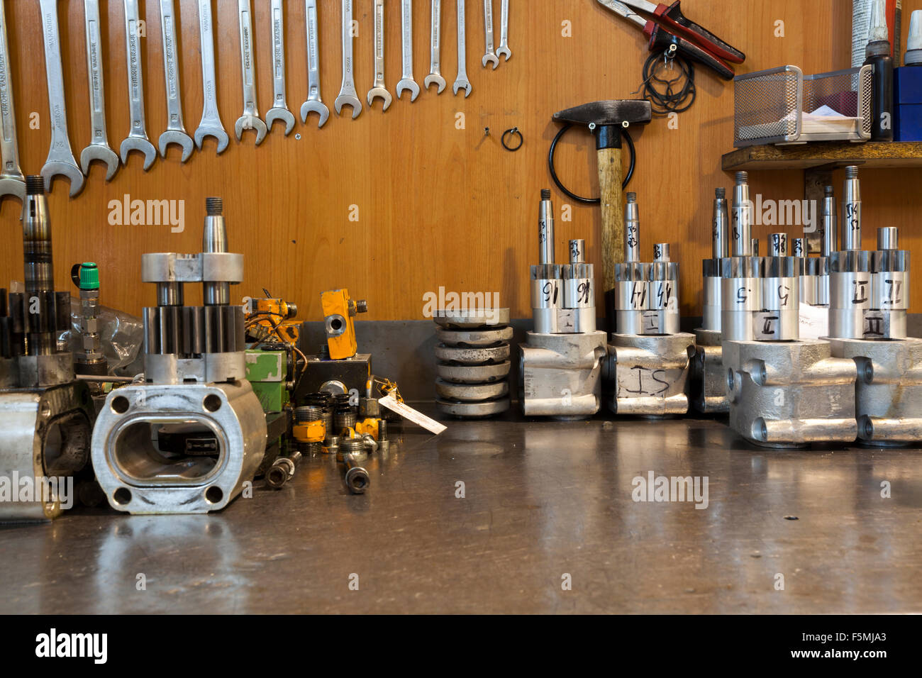 hydraulic engine parts on the work table Stock Photo - Alamy