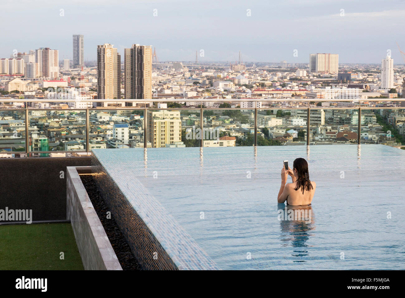 Woman on rooftop taking hi-res stock photography and images - Alamy