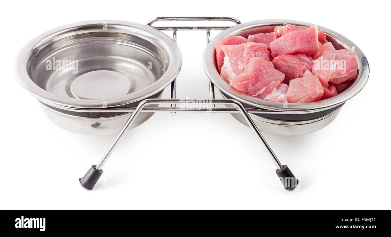 Meat and water for pets in metal bowls isolated on white background ...