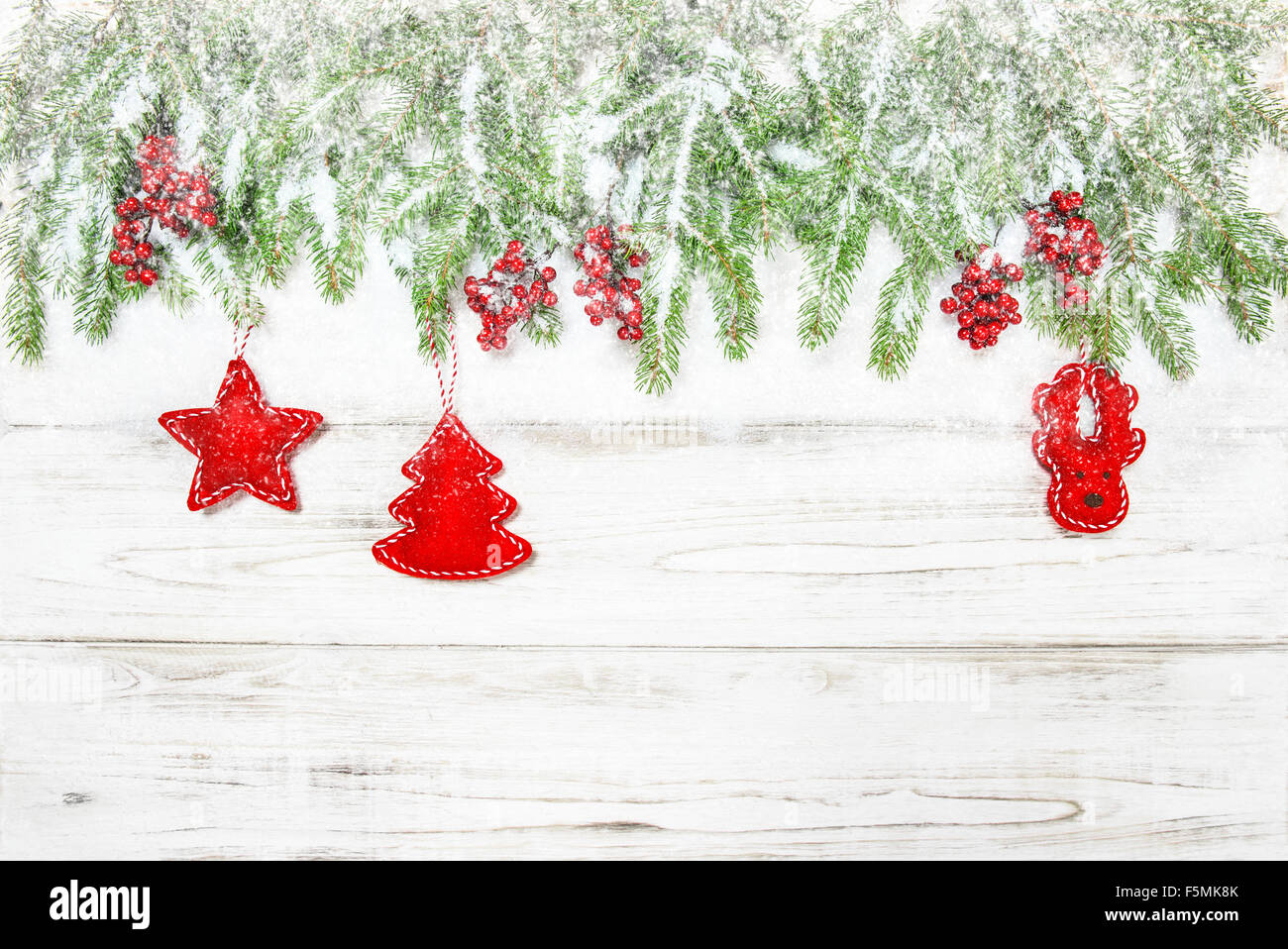 Christmas background. Evergreen tree branch with red decoration and ...
