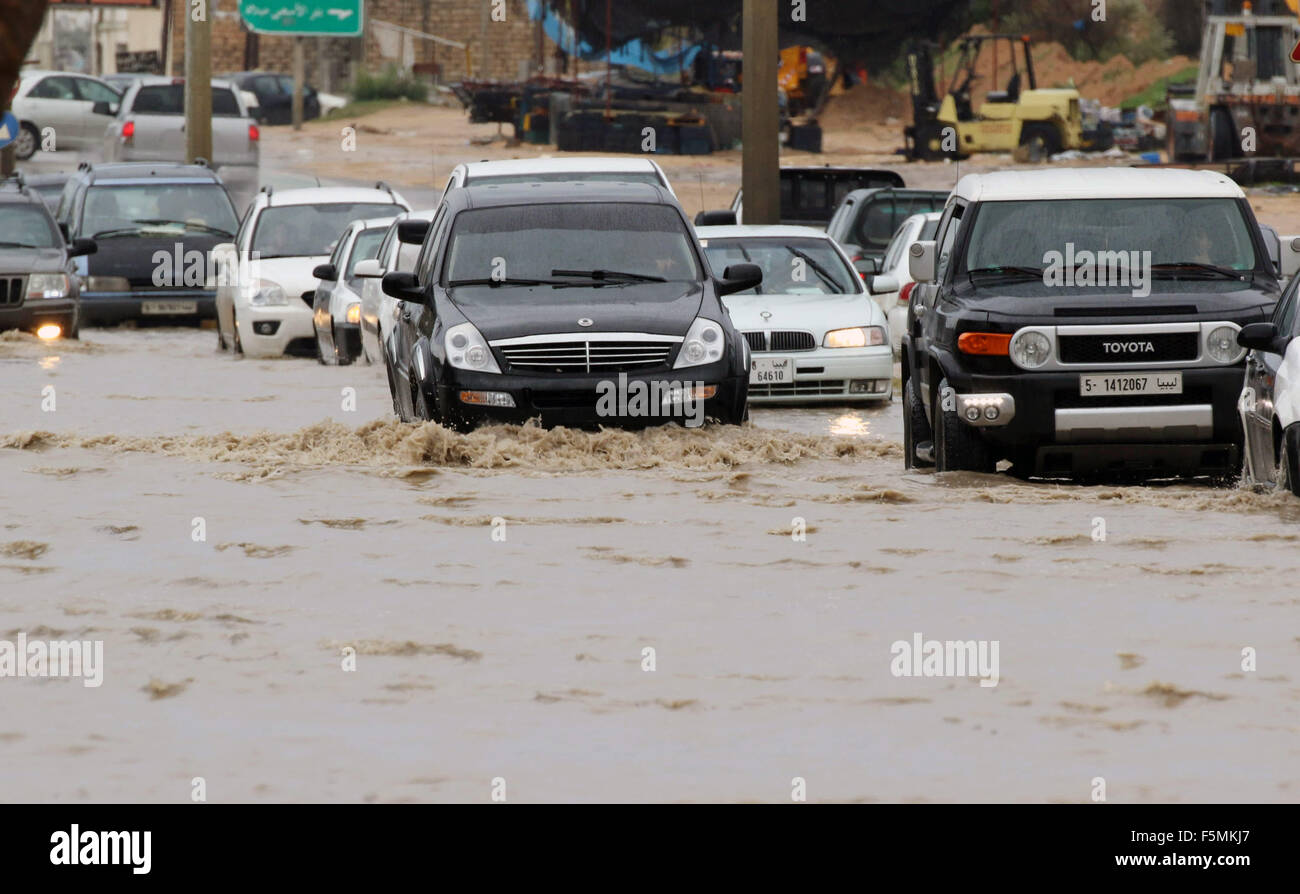 Tripoli, Libya. 6th Nov, 2015. Cars run on a flooded street in Tripoli ...