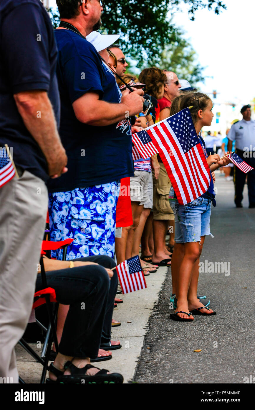 The sidewalk patriotic audience show their support for Memorial day by ...