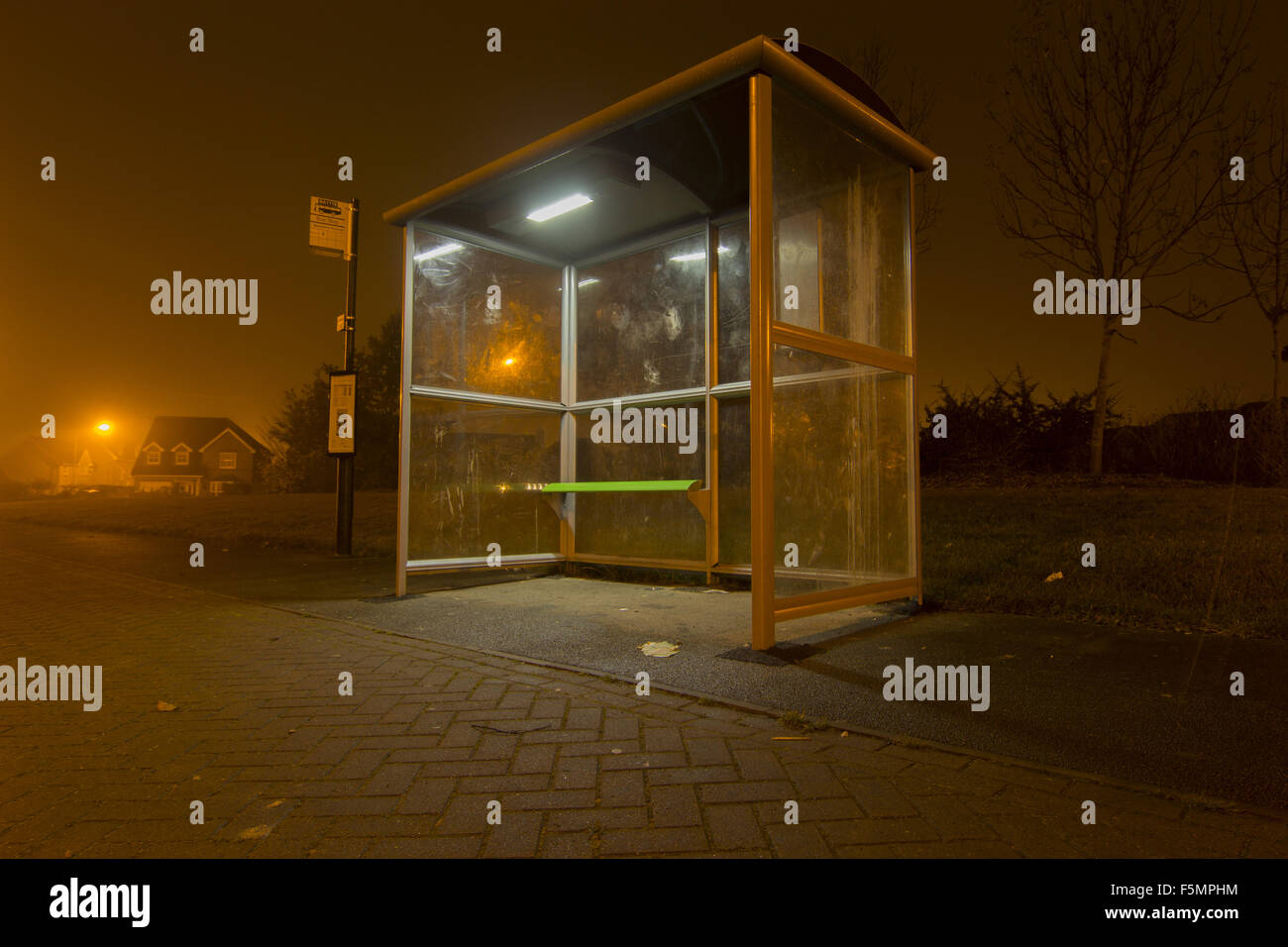 A bus stop at night Stock Photo - Alamy