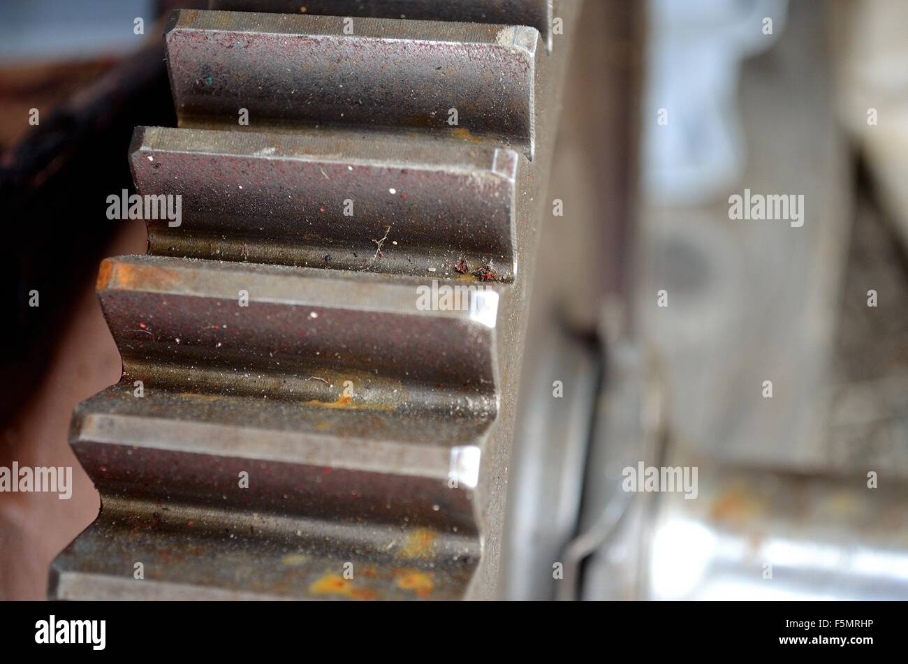 big old rusted flywheel closeup Stock Photo - Alamy