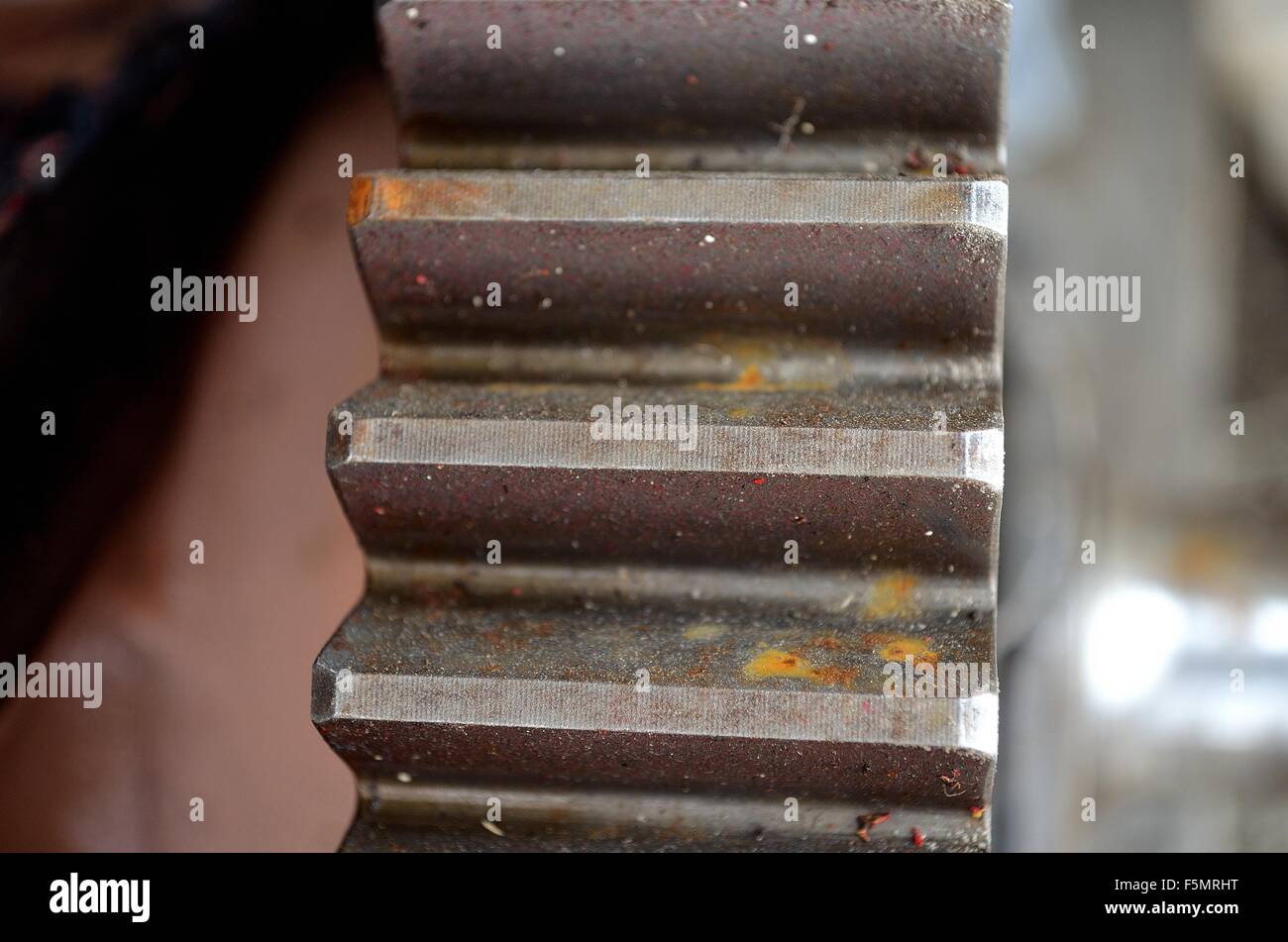 big old rusted flywheel closeup Stock Photo - Alamy