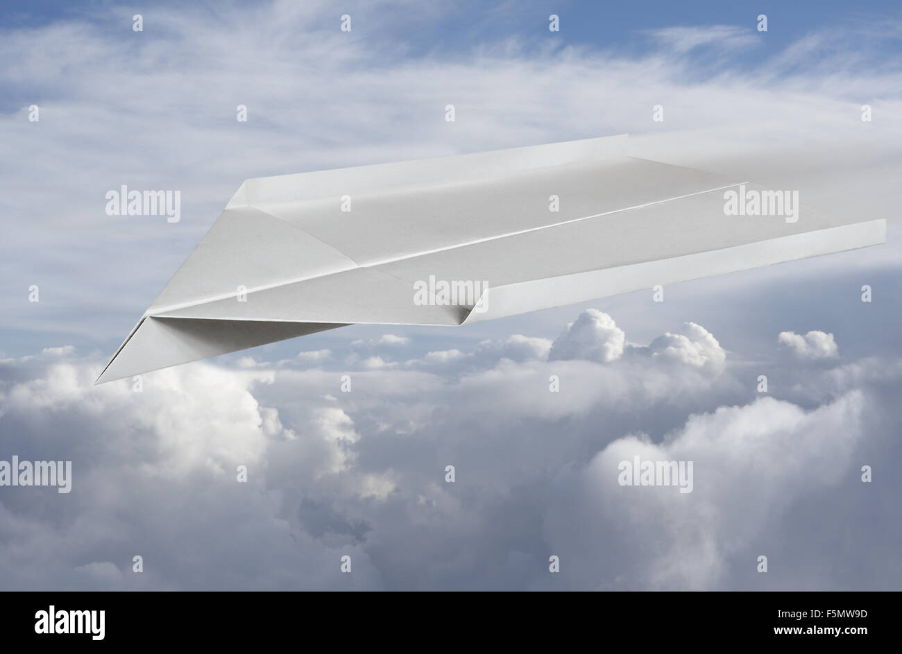 Paper plane flight over clouds Stock Photo - Alamy