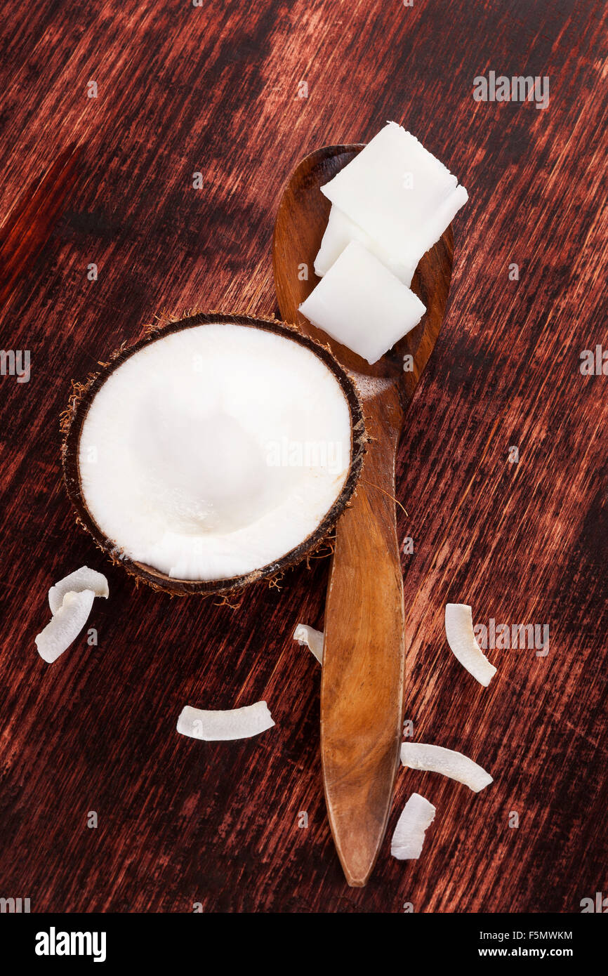 Coconut oil background. Hard coconut oil, coconut flakes and coconut on ...