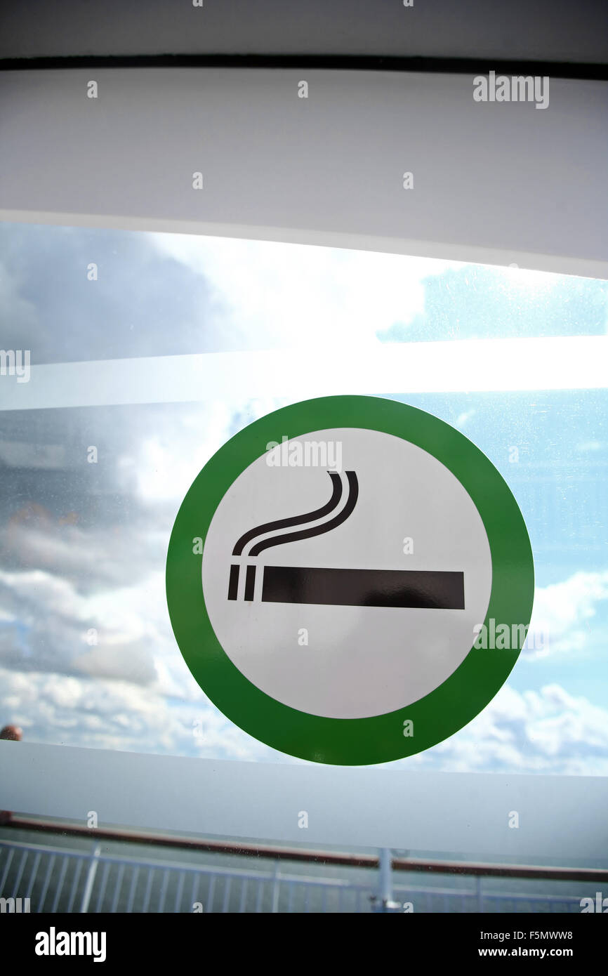 Picture of a sign marking the designated smoking area on a window Stock ...