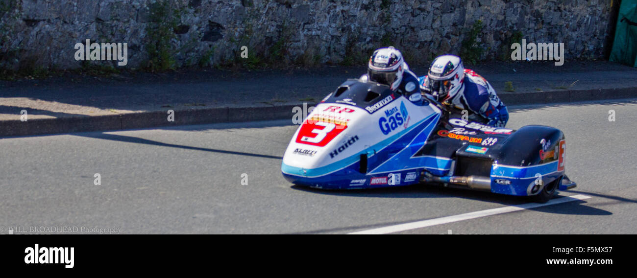 Hard on the brakes as the sidecar approaches Castletown corner in the ...