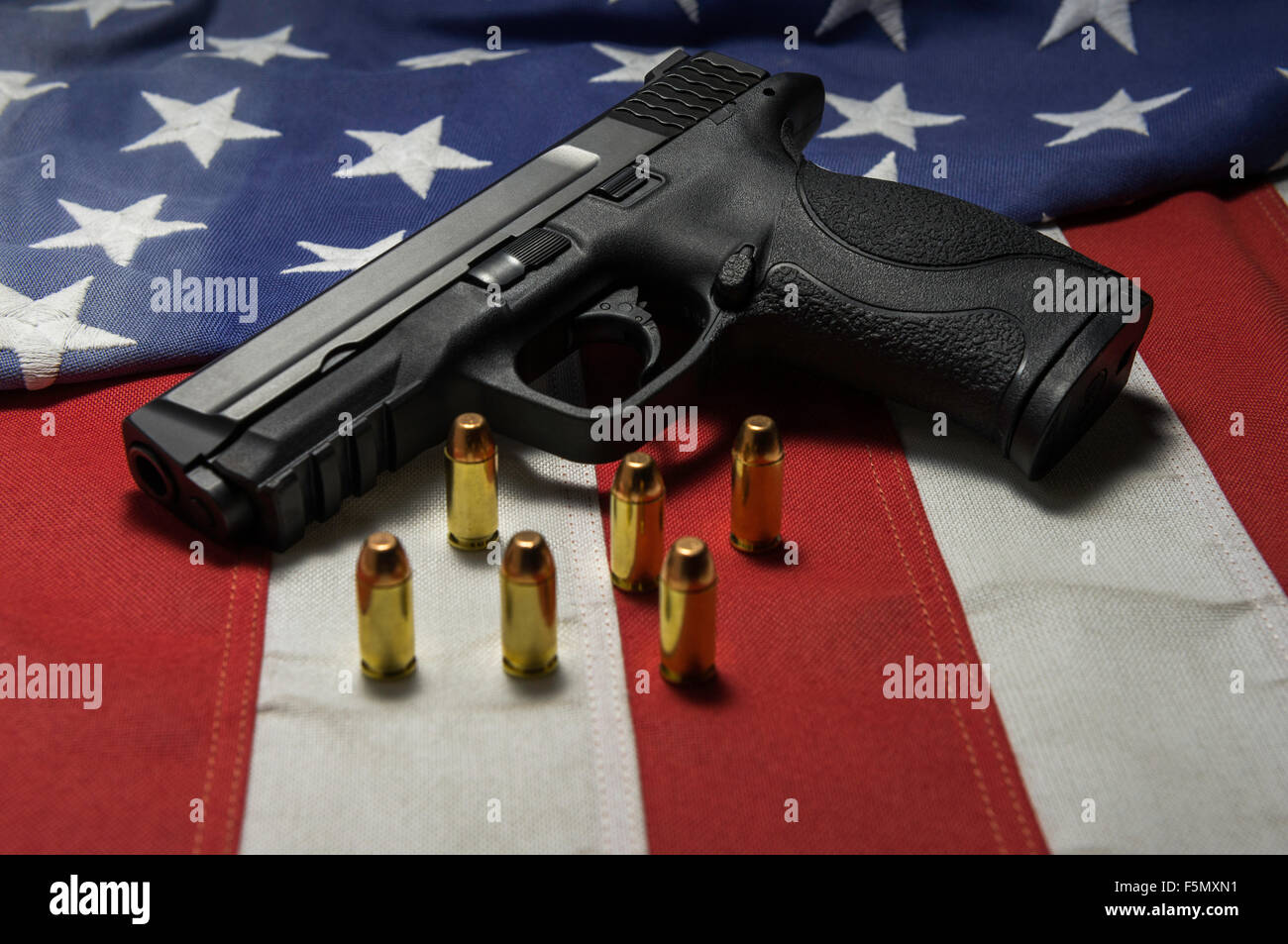 hand gun with American flag Stock Photo - Alamy