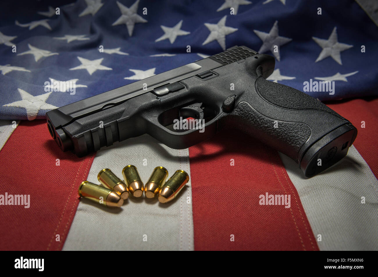 hand gun with American flag Stock Photo - Alamy