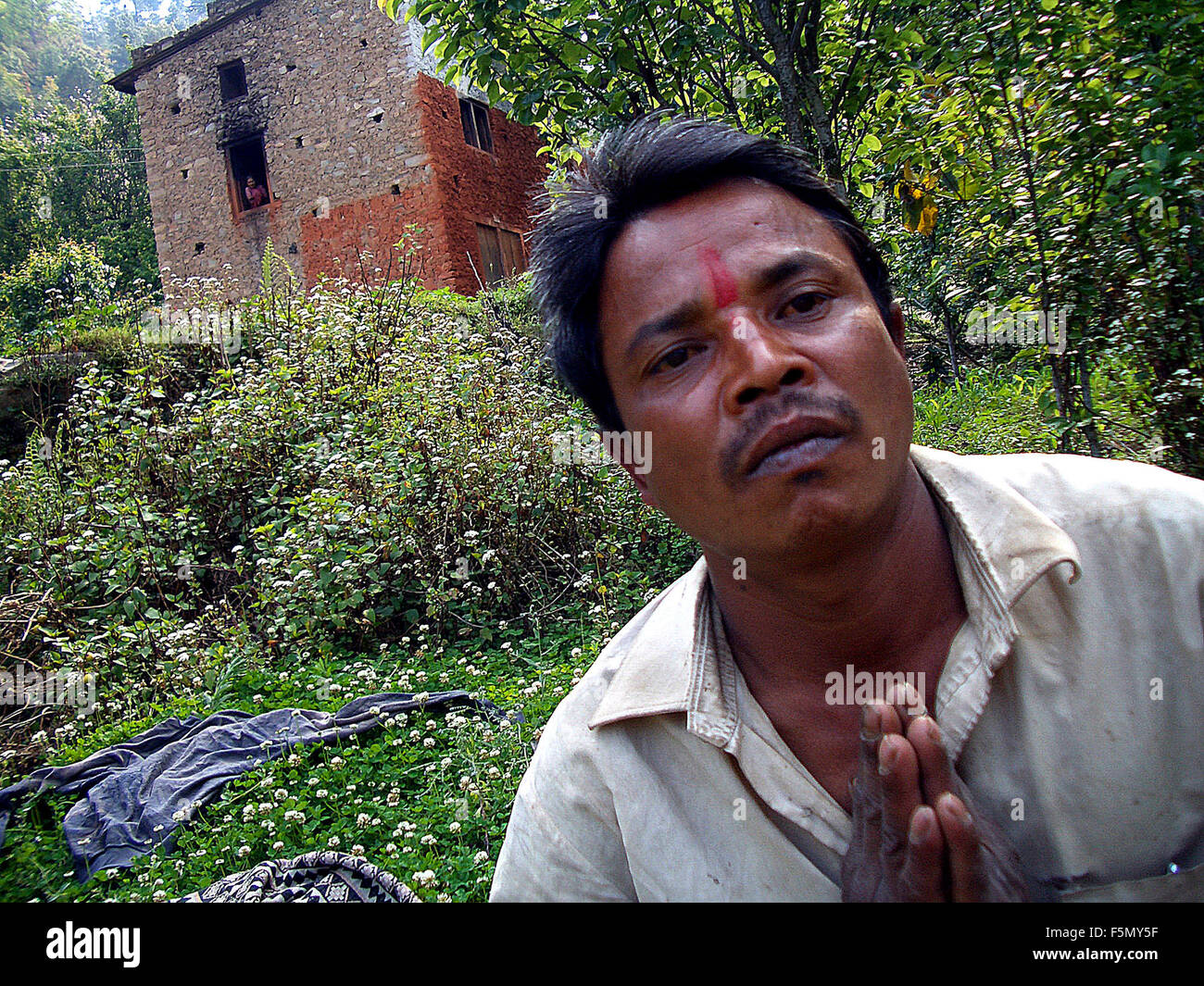 Khatmandu Valley, Nepal. 24th Mar, 2004. A man gives the Nepal greeting ...