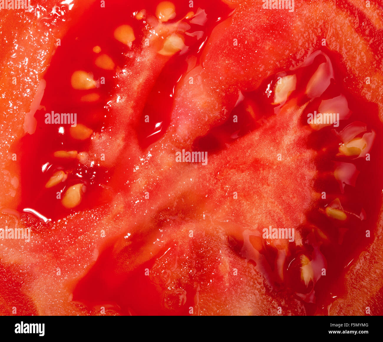 Closeup view of fresh tomato cut Stock Photo - Alamy