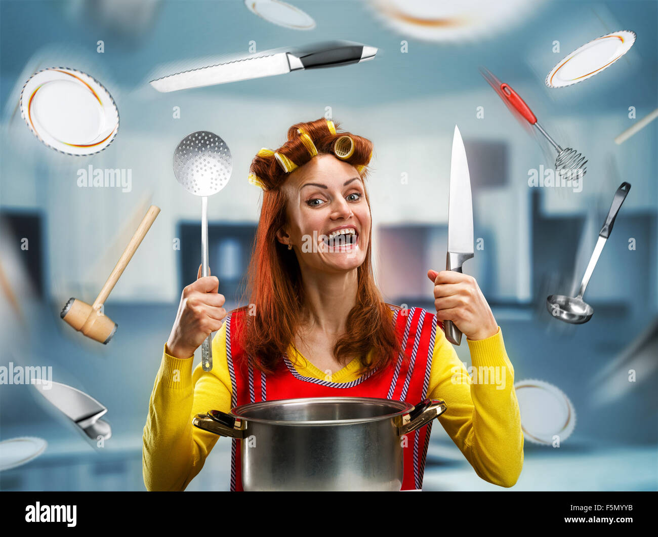 Happy smiling housewife with flying kitchen tools Stock Photo - Alamy