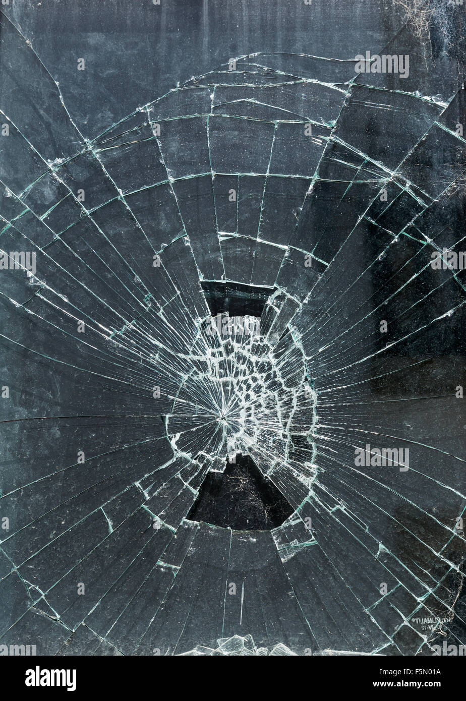Broken window glass with many cracks background Stock Photo - Alamy