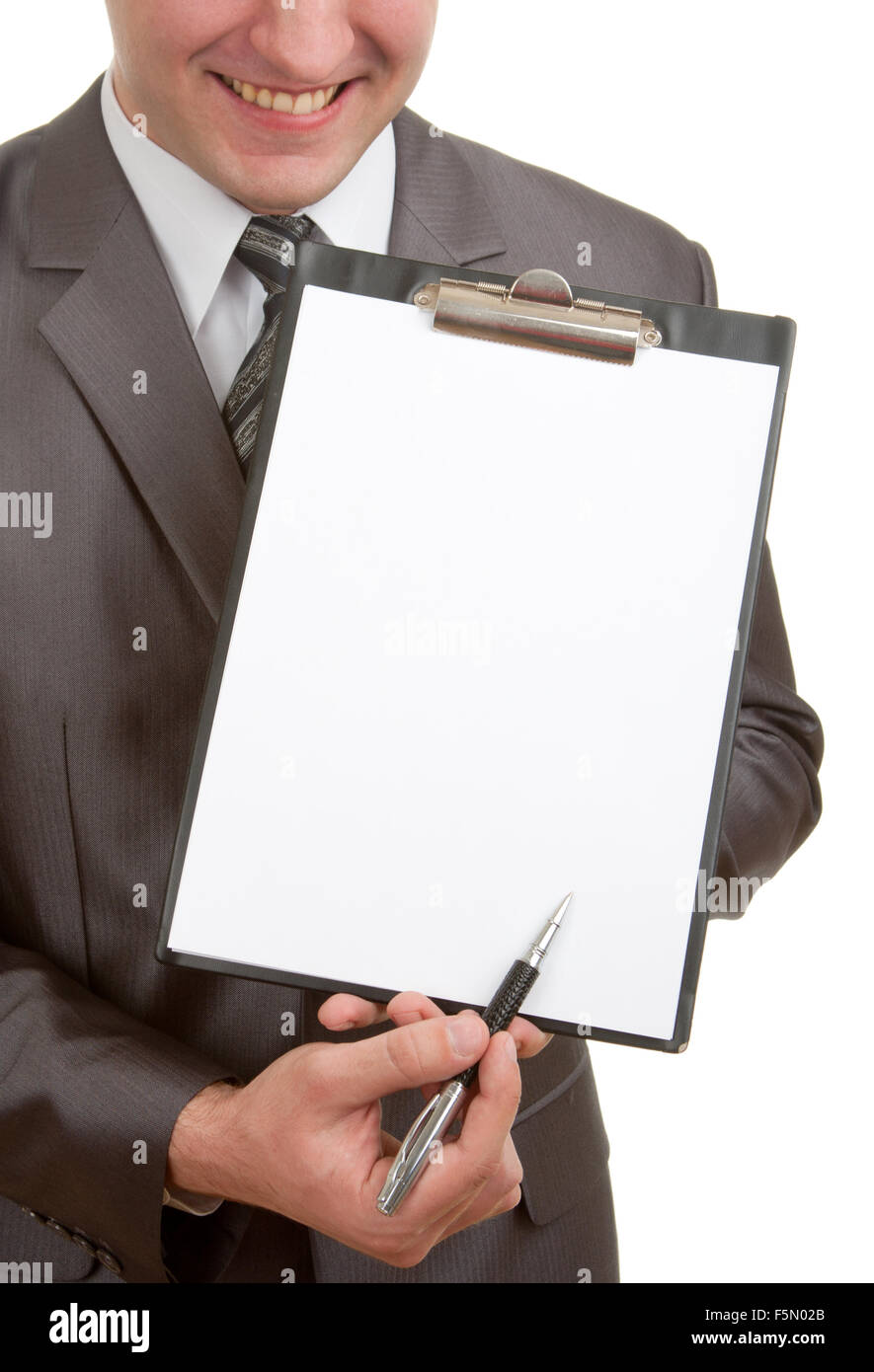 Smiling businessman pointing clipboard. Isolated on white Stock Photo ...