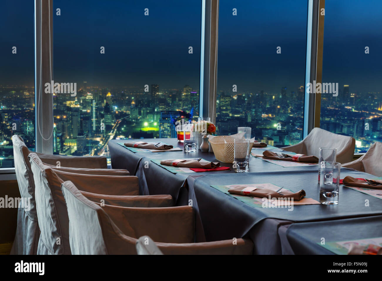 Restaurant with night Bangkok in the window Stock Photo - Alamy