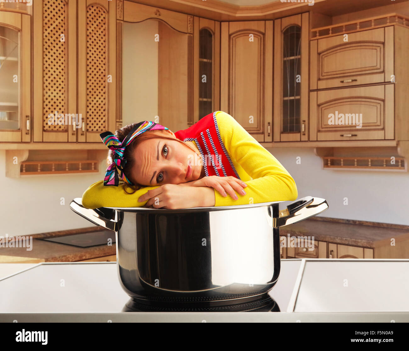 Sad housewife on the kitchen Stock Photo - Alamy