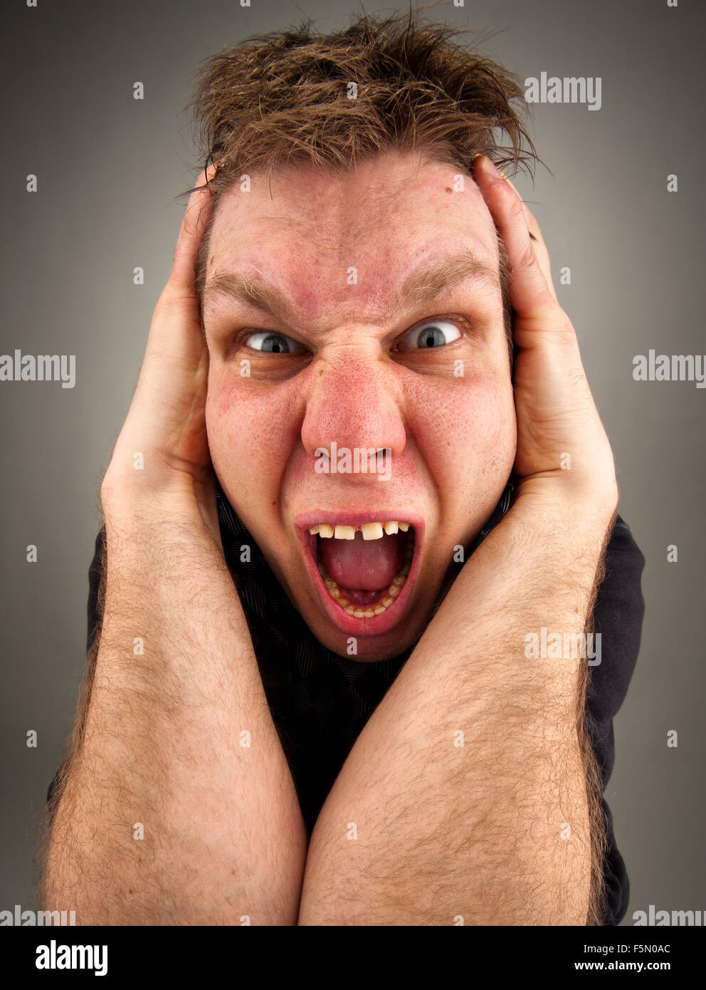 Angry guy making face hi-res stock photography and images - Alamy