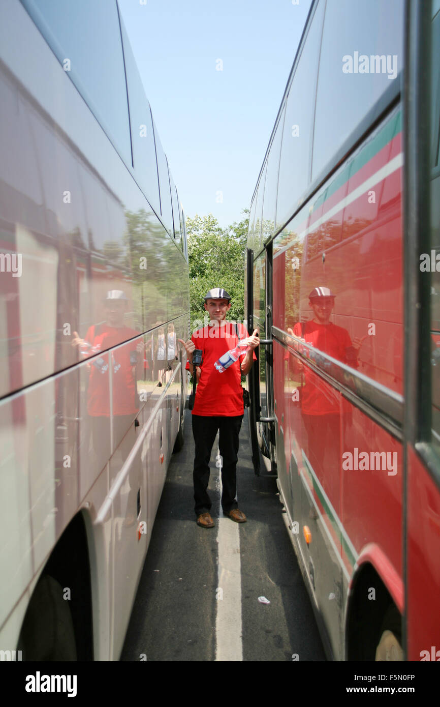 Happy traveler between two buses Stock Photo - Alamy