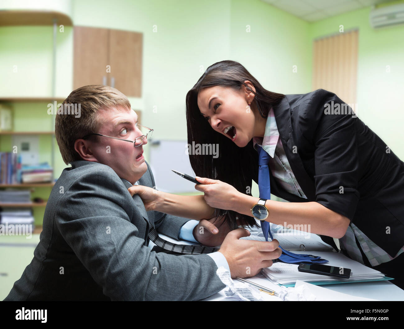 Two young caucasian office worker starting to fight Stock Photo - Alamy