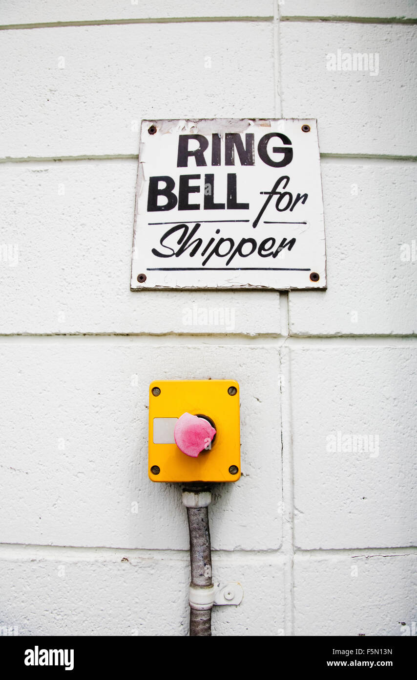 ring for service sign outside warehouse Stock Photo - Alamy